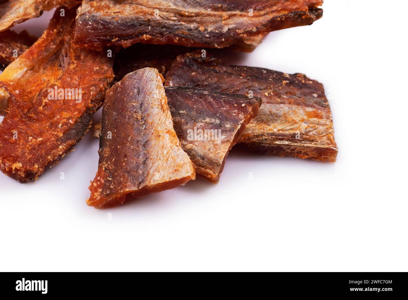 Pieces of cleaned dried fish isolated on white. Dry Peppered Pollack ...