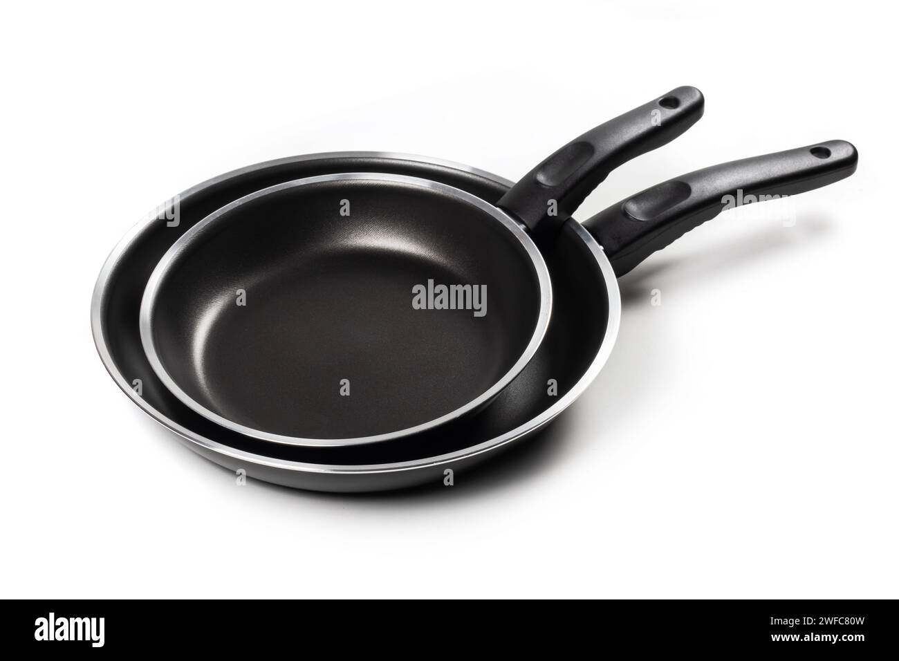 Two pans with handle on white background Stock Photo - Alamy