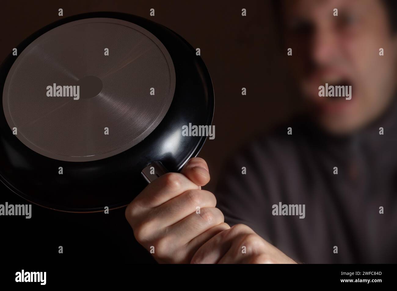 Photo of crazy angry mad outraged man hold kitchen pan Stock Photo - Alamy