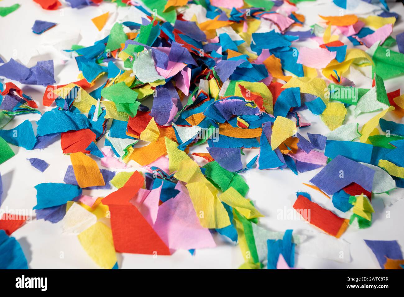 small pieces of confetti on white background Stock Photo - Alamy