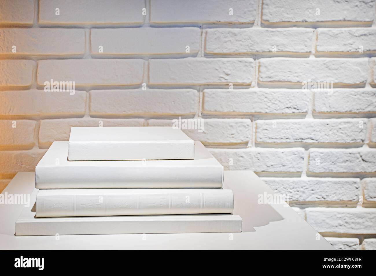 stack of white books on a white wall background. Education and Stock ...