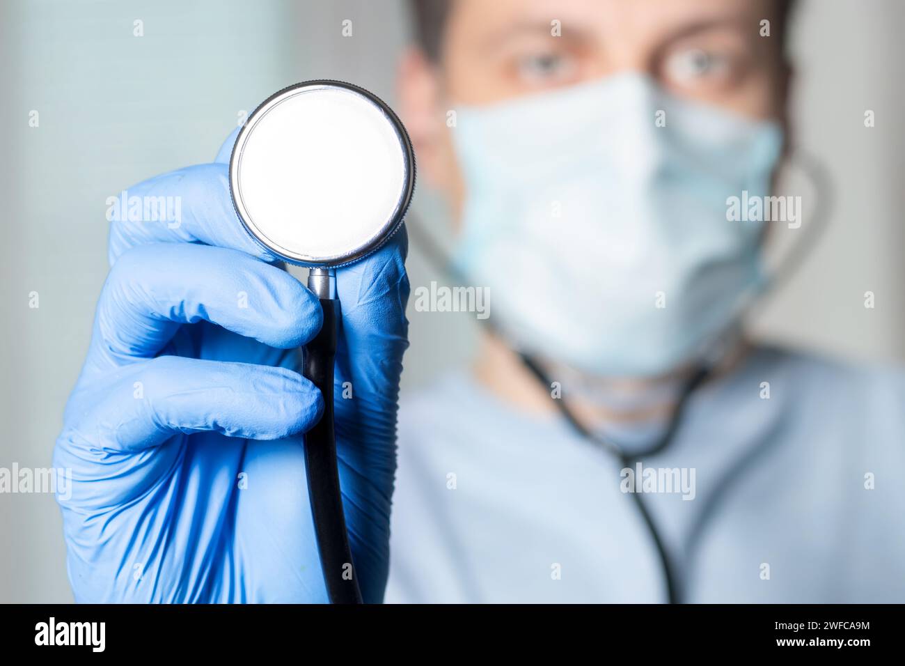 Male doctor showing stethoscope for checkup. Close up of doctor hand ...