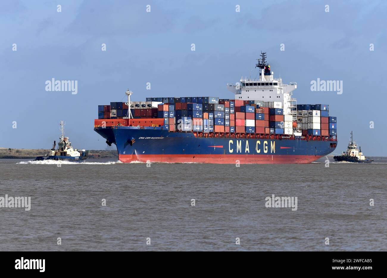 Buffeted by 20mph winds Svitzer tugs bring container ship CMA CGM ...
