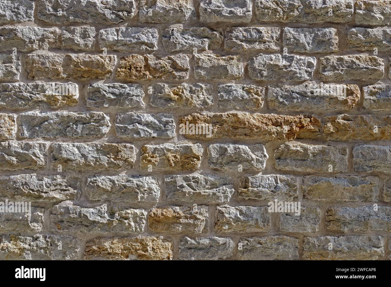 Beige stone wall background. Detail of a medieval stone wall. Seamless ...
