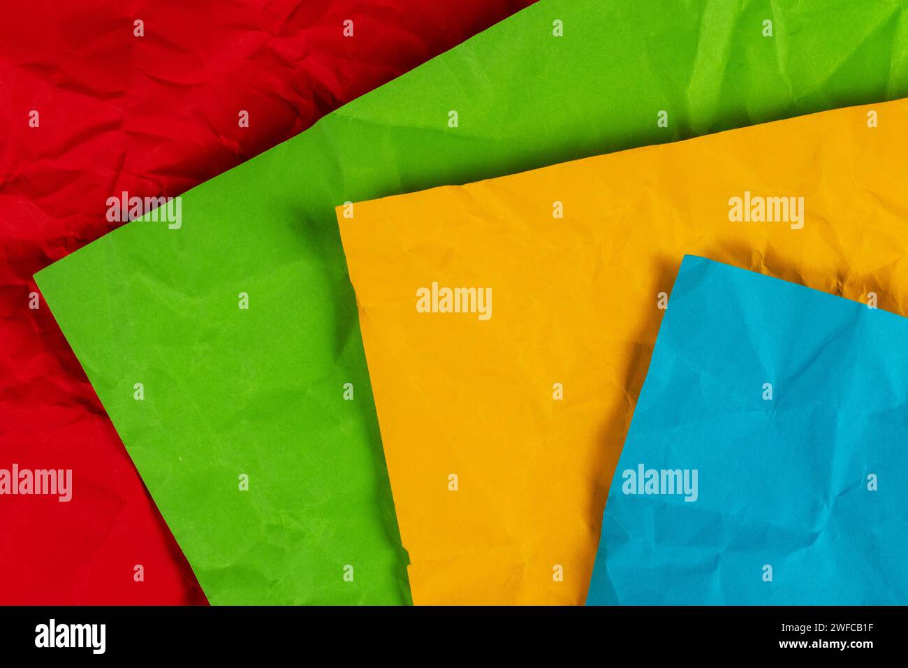 Colorful crumpled paper texture background Stock Photo - Alamy