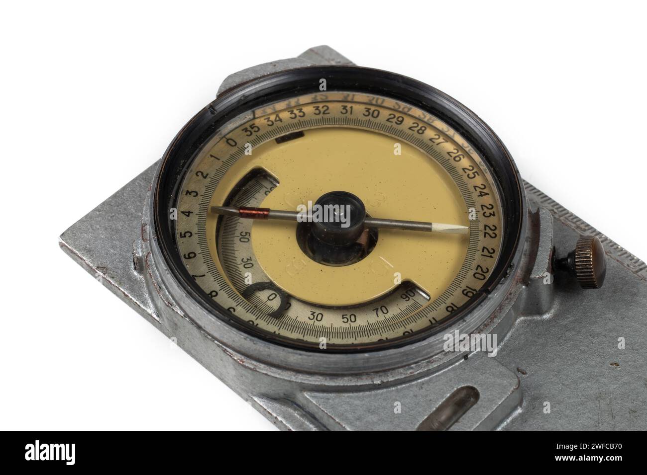 Old mining compass on white background close up Stock Photo - Alamy