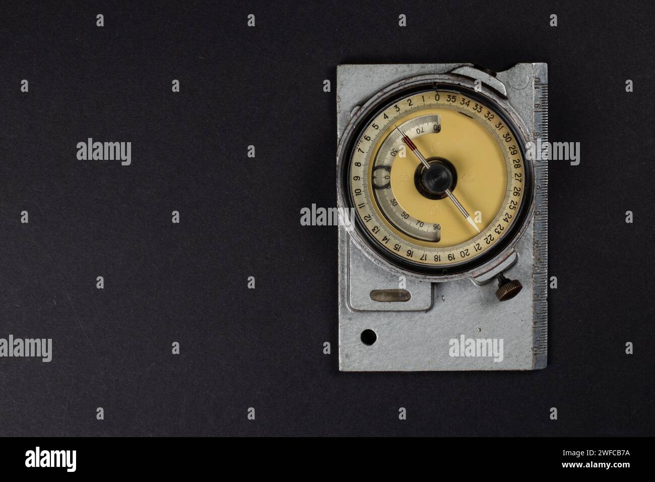 Old geological compass on dark background close up Stock Photo - Alamy