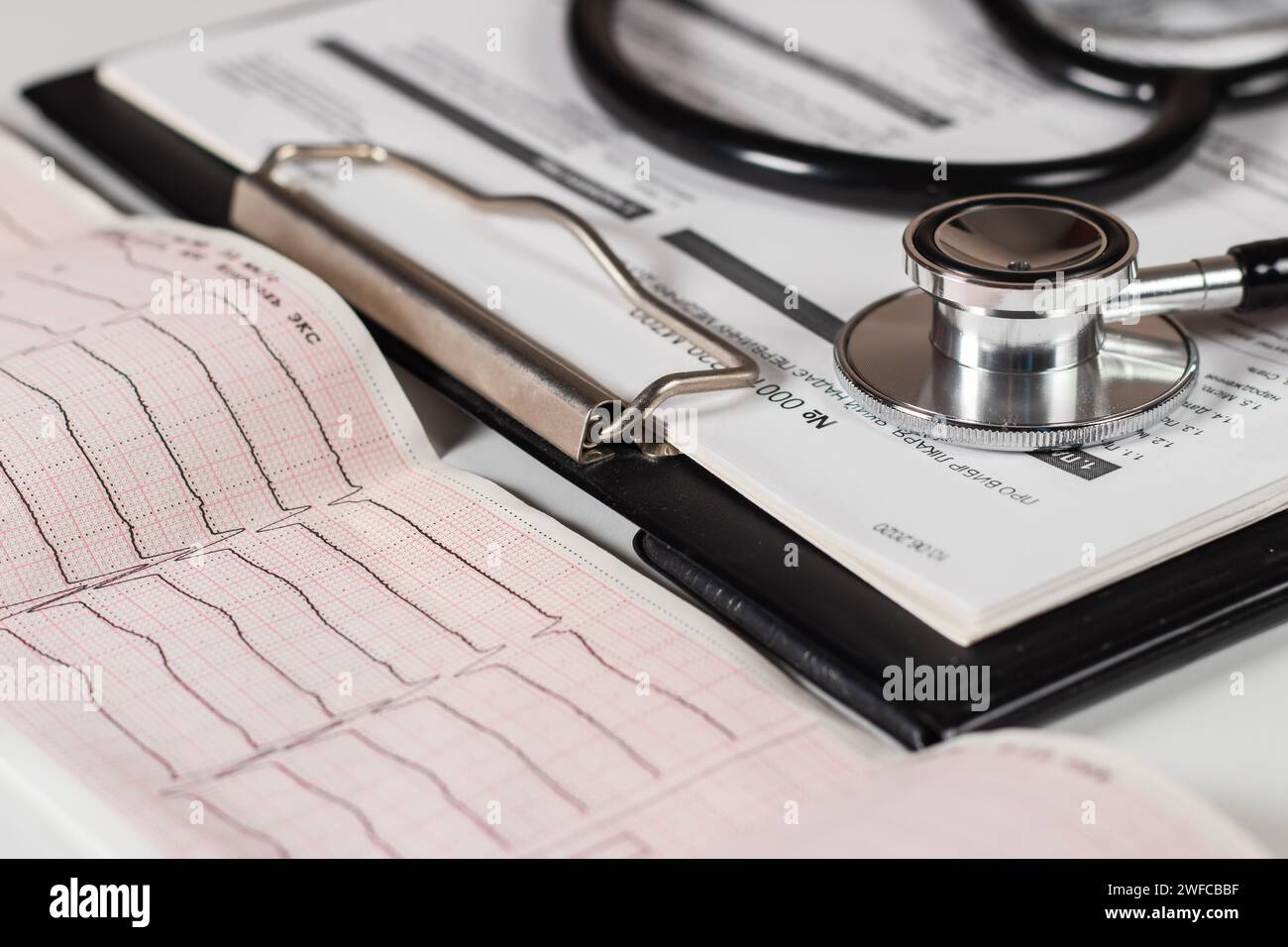 Stethoscope on electrocardiogram ECG chart paper. ECG heart chart scan ...