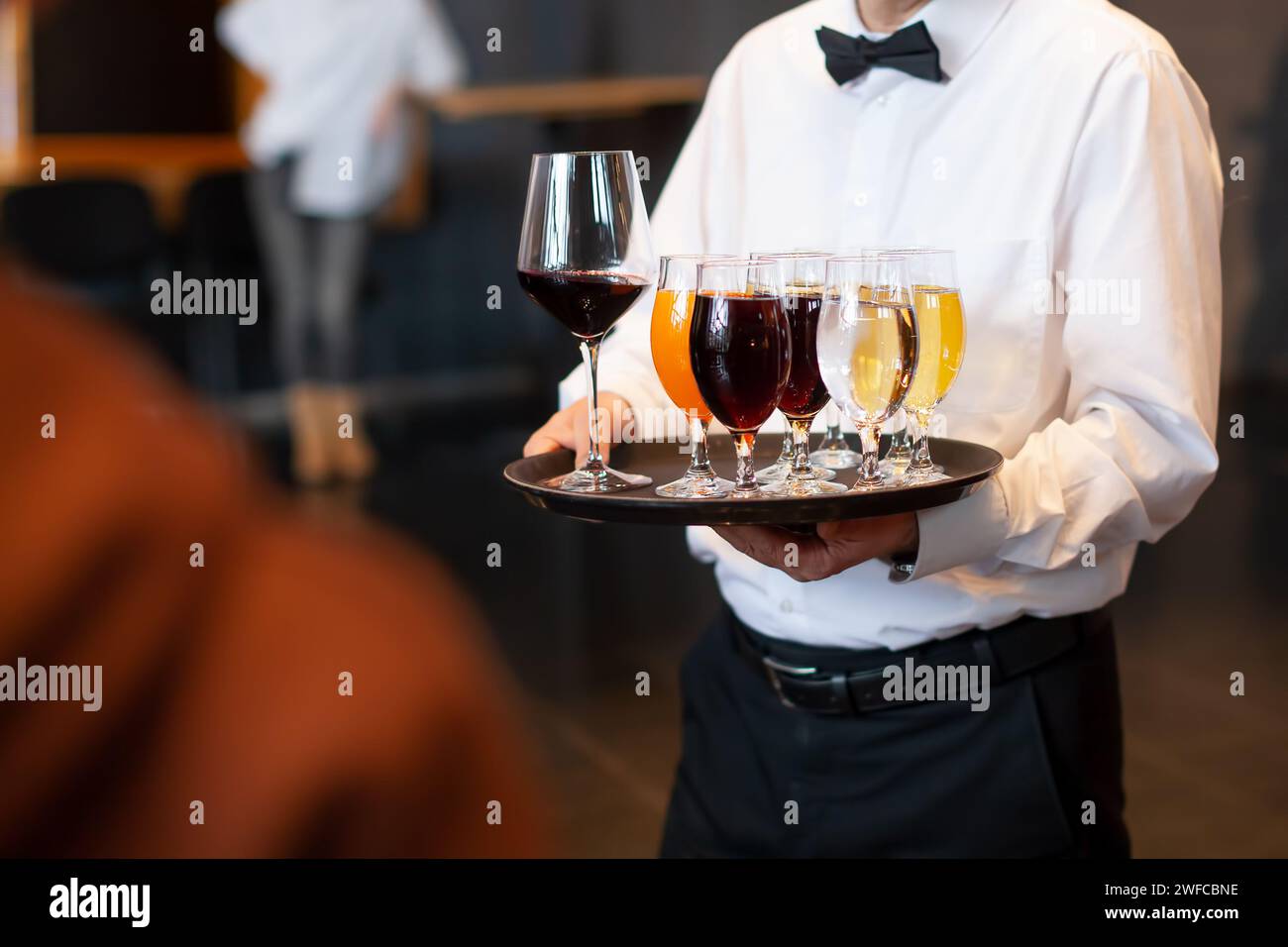 waiter serving drinks at a gala party Stock Photo - Alamy