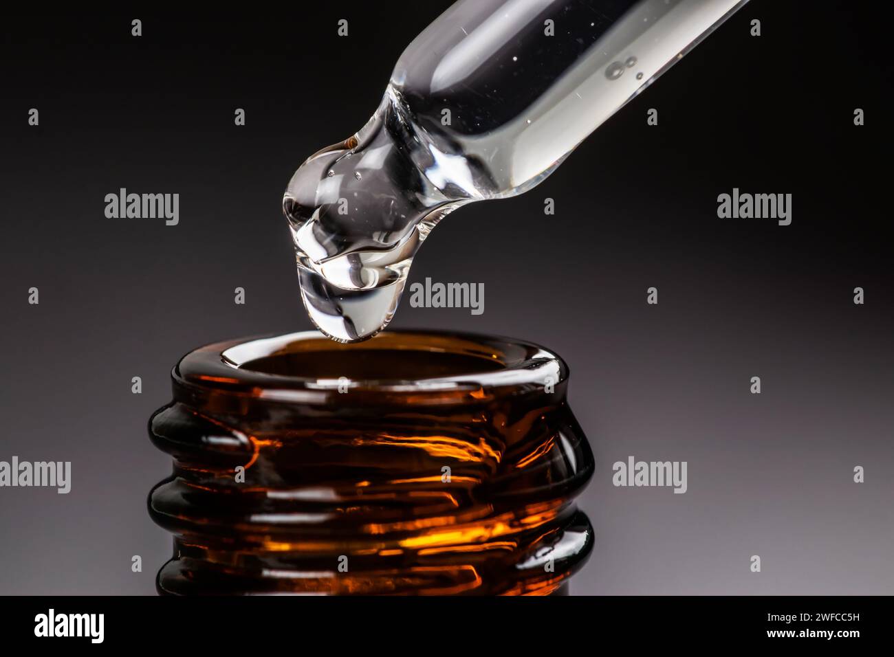 Essential oil drips from pipette hi-res stock photography and images ...