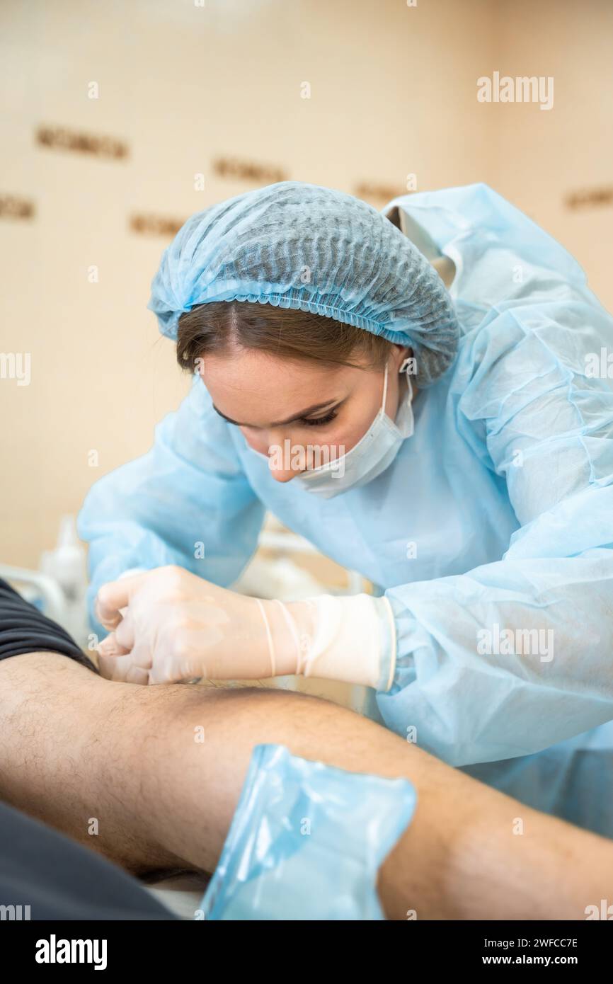 Dermatologist surgeon woman removes skin diseases, close up view of ...