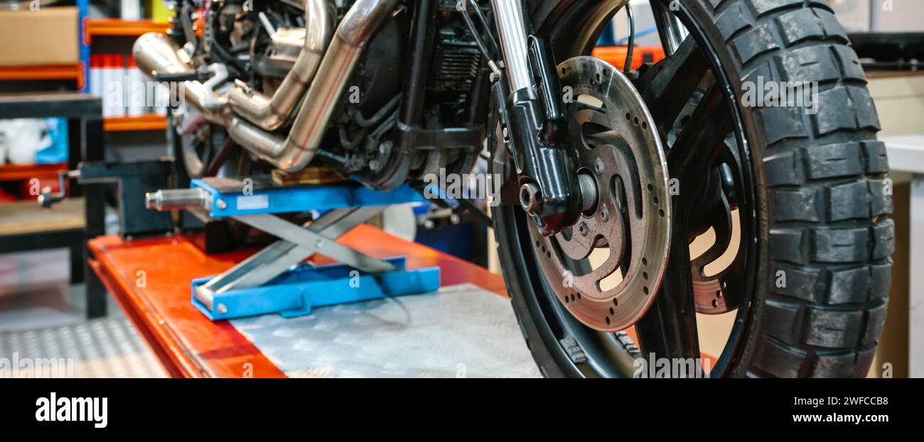 Banner of front wheel tyre and brake disk of custom motorbike on ...