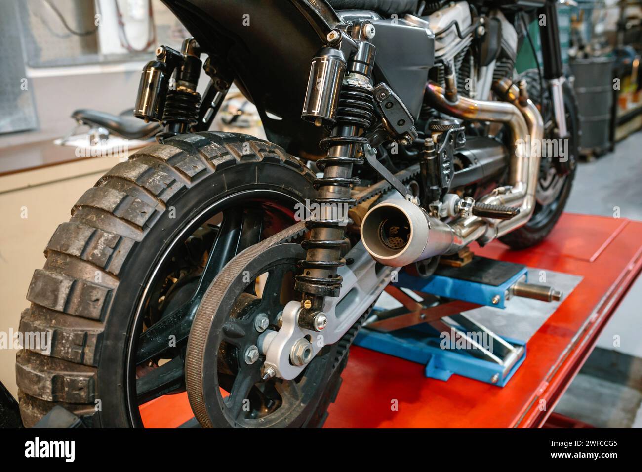 Back view of exhaust pipe and shock absorber of custom motorbike on ...