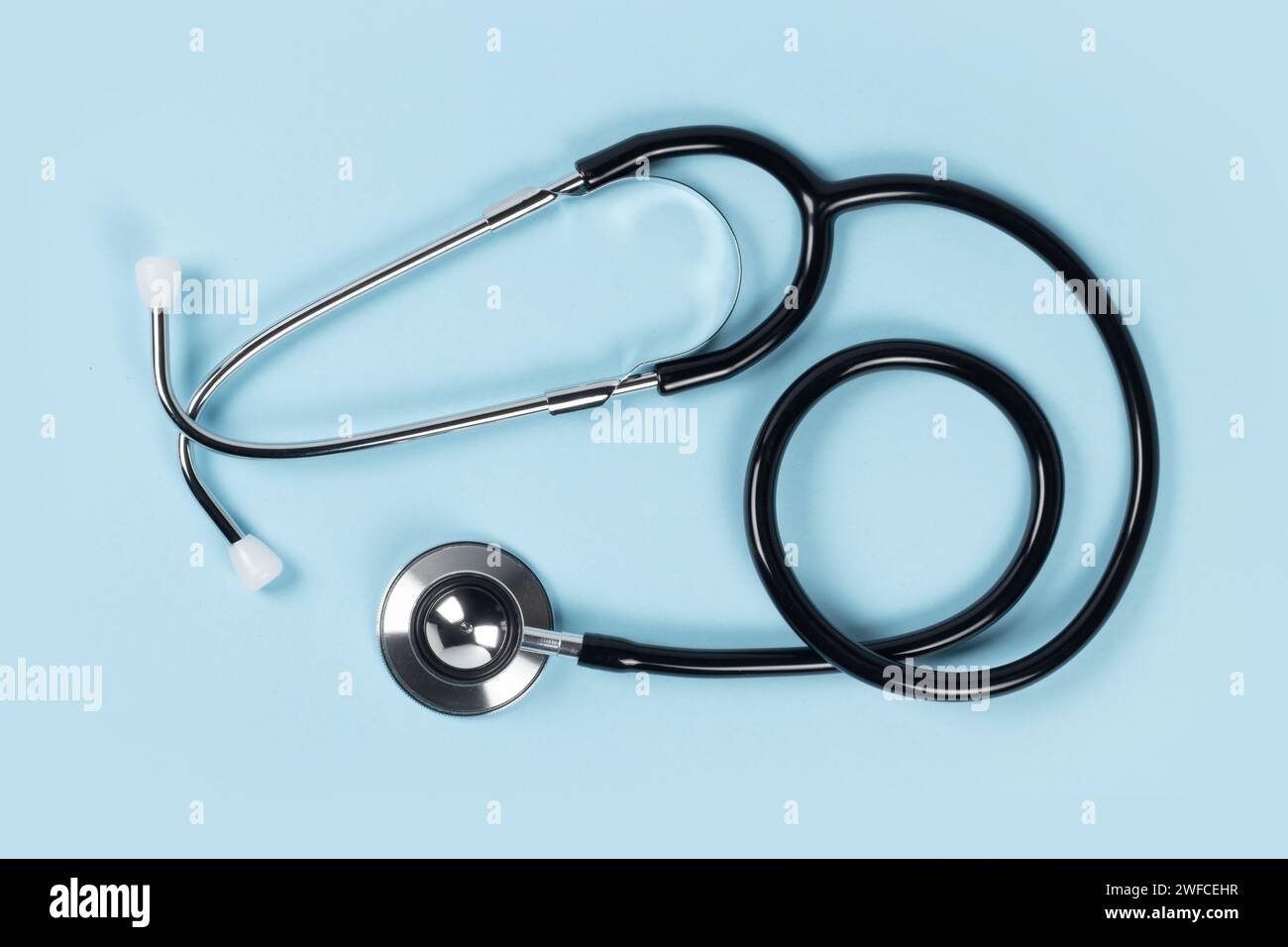 Stethoscope on blue background. The stethoscope is a medical instrument ...