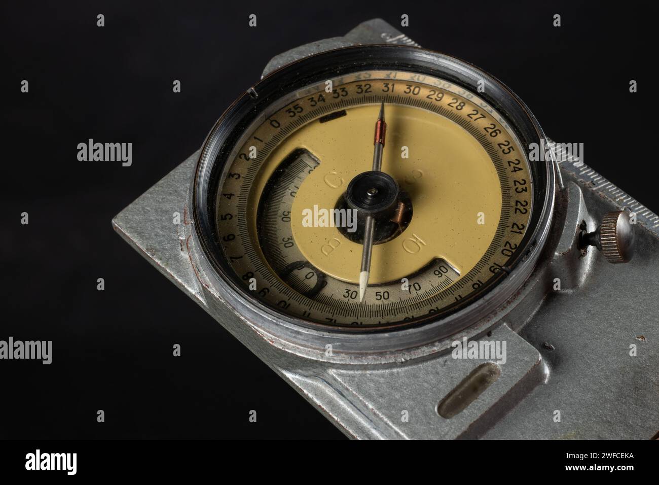 Old geological compass on dark background close up Stock Photo - Alamy