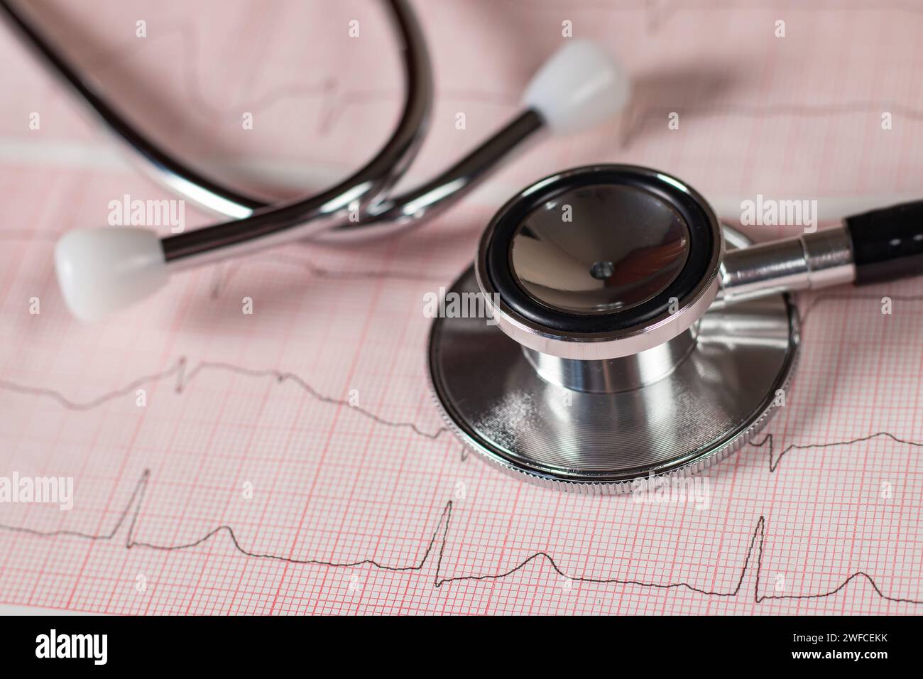 Stethoscope on electrocardiogram ECG chart paper. ECG heart chart scan ...