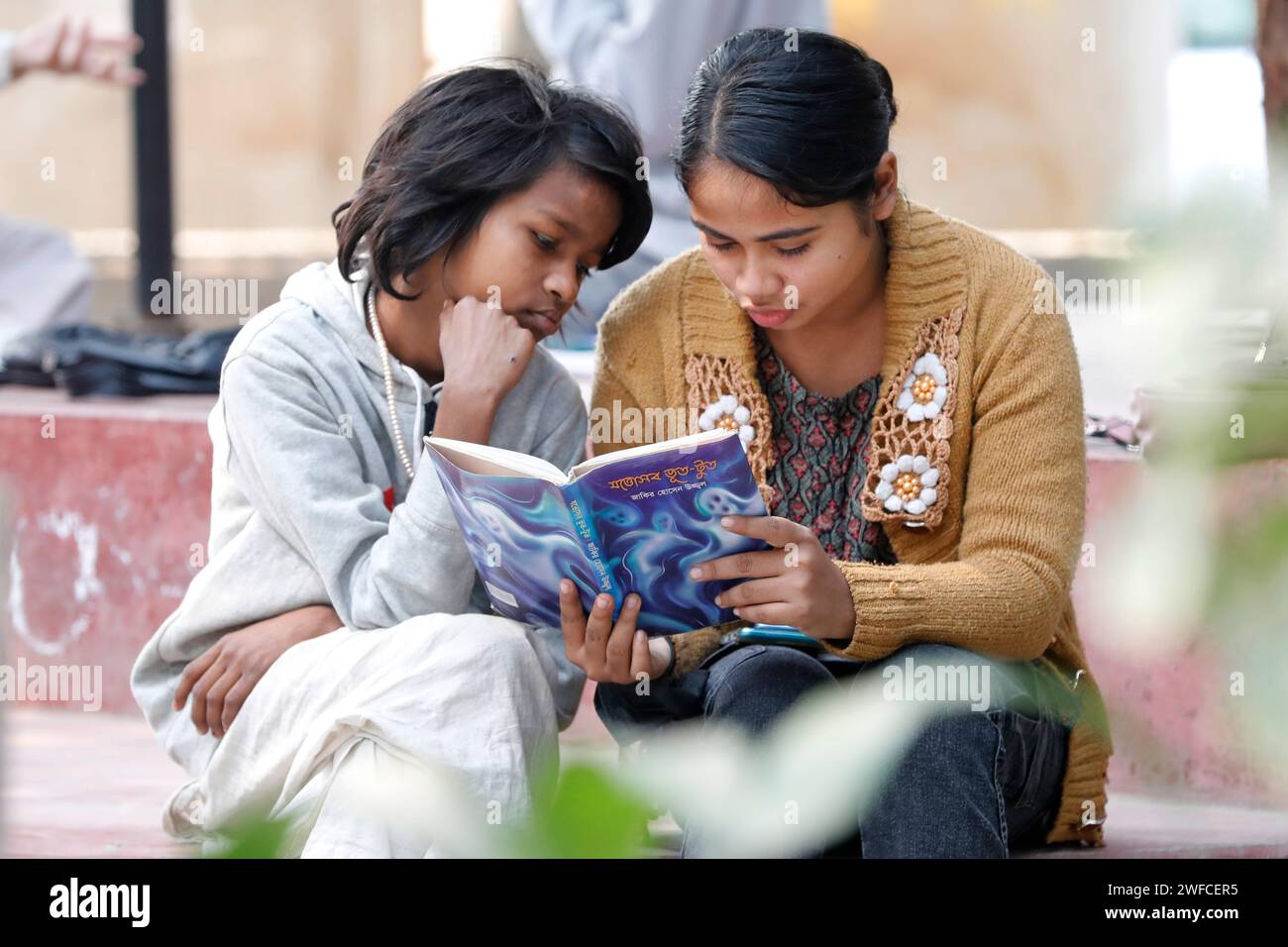Dhaka, Bangladesh - January 30, 2024: In the open library in front of ...
