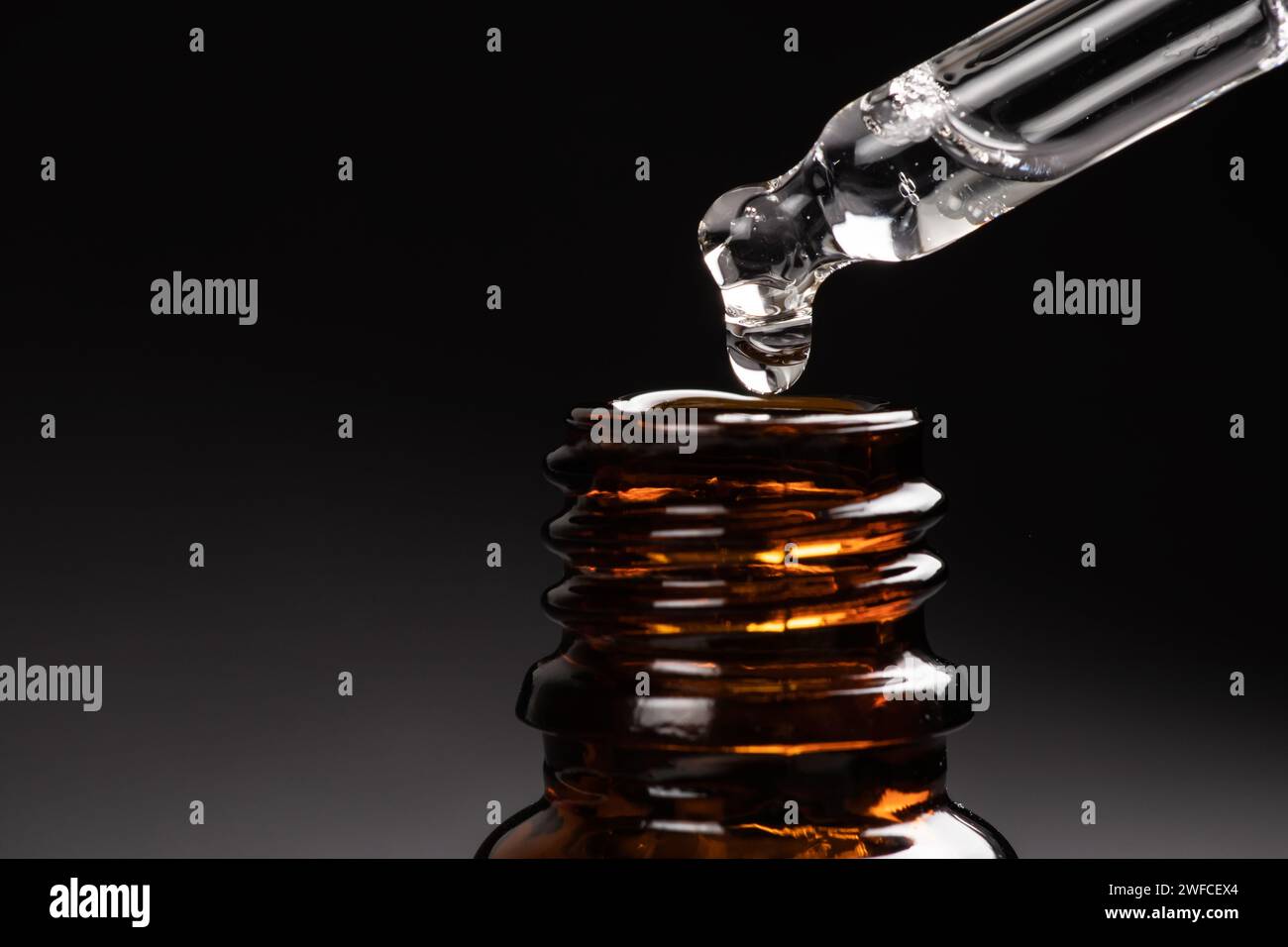 Essential oil drips from pipette hi-res stock photography and images ...