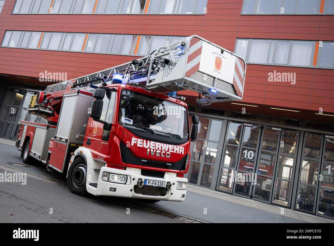 Potsdam, Germany. 30th Jan, 2024. An emergency vehicle with a turntable ...