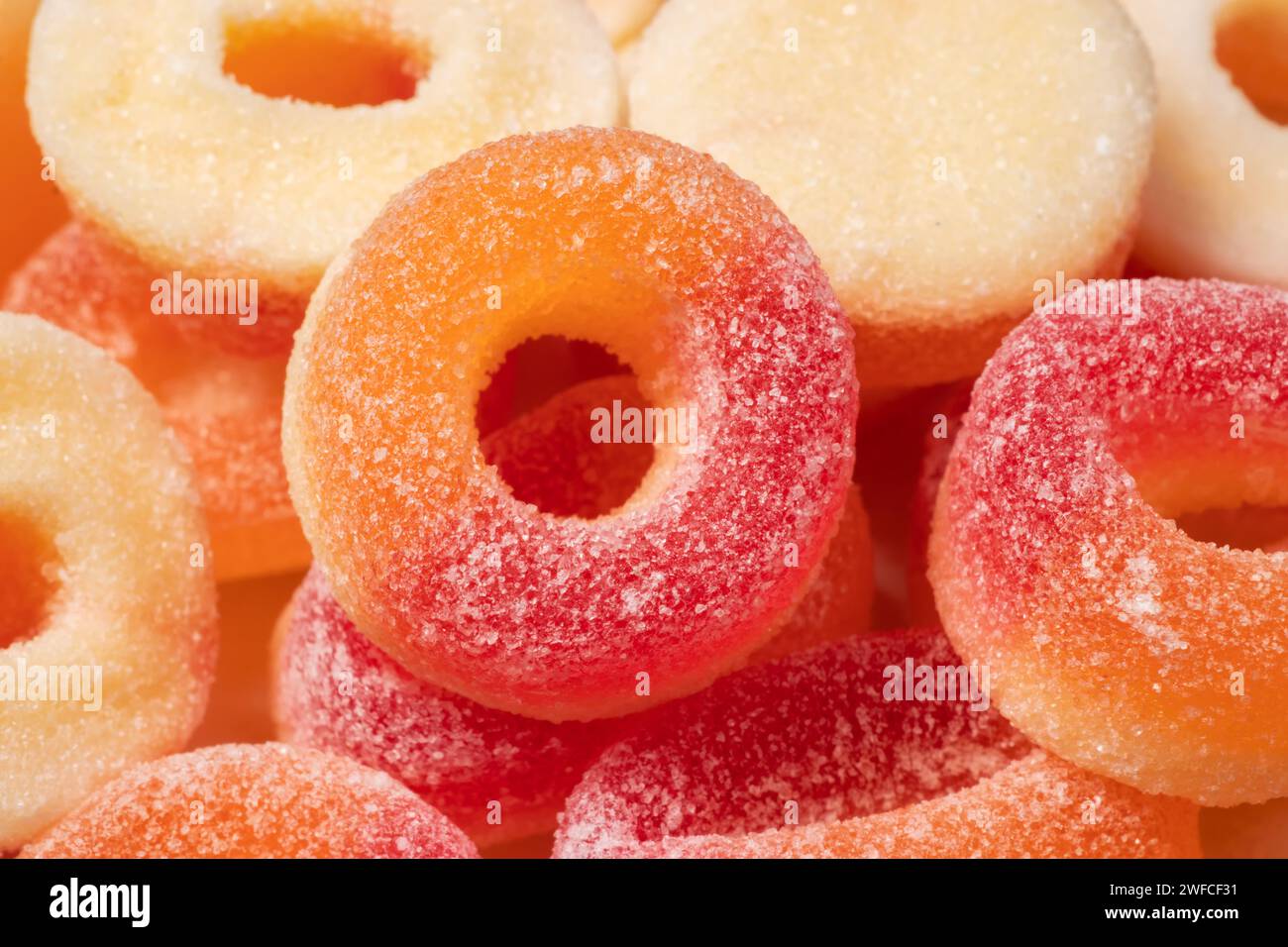 Gummy rings with sugar background. Close up Stock Photo - Alamy