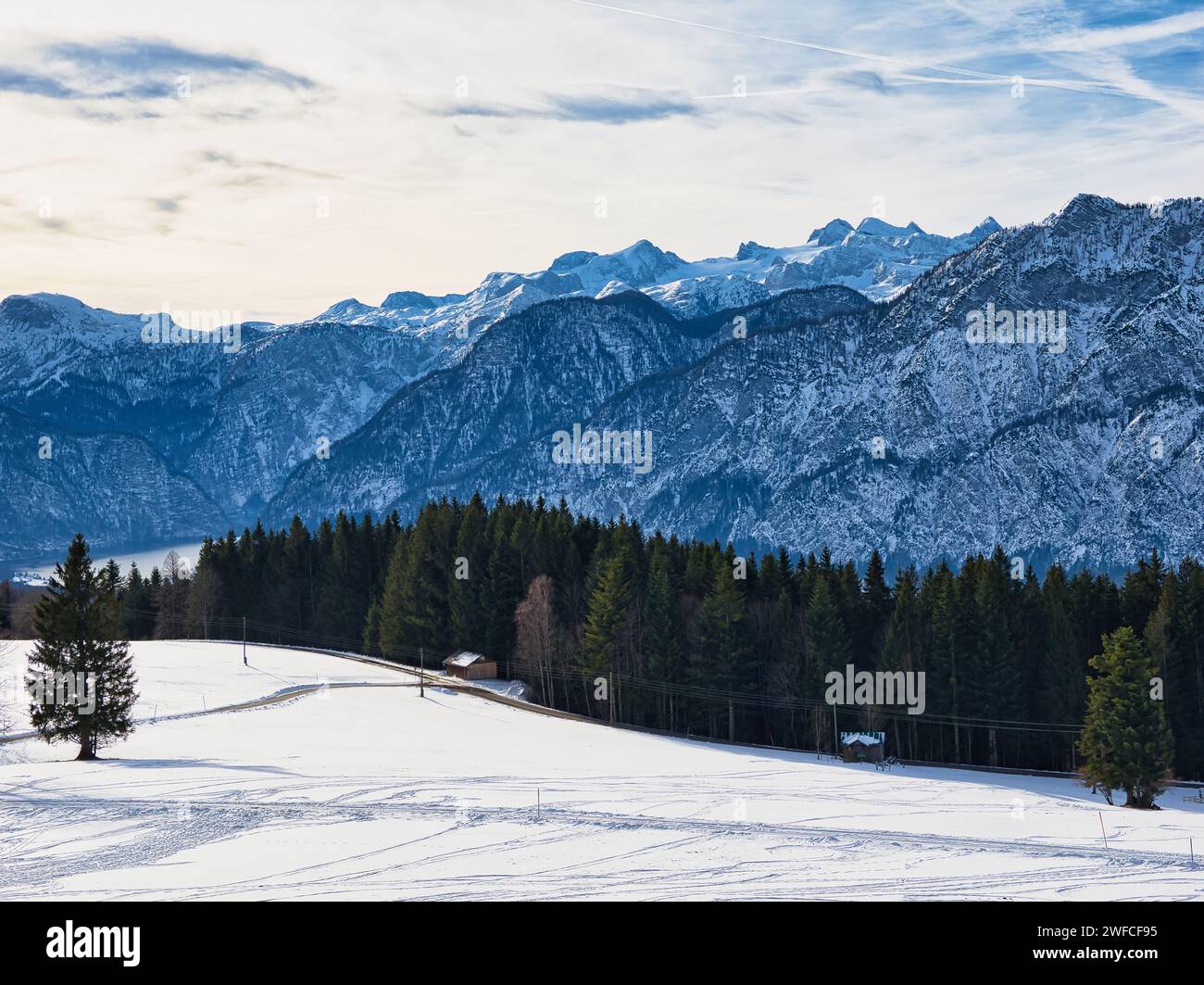 A mountain peak with snow-covered trees in the World Heritage region of ...