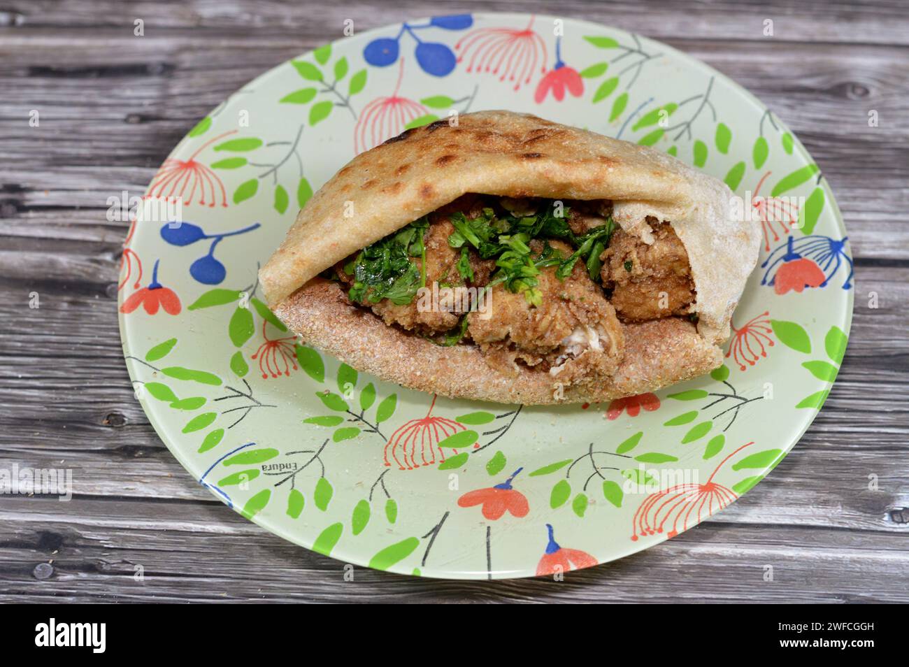 Cow beef brain covered with flour and fried in deep hot oil, a sandwich ...