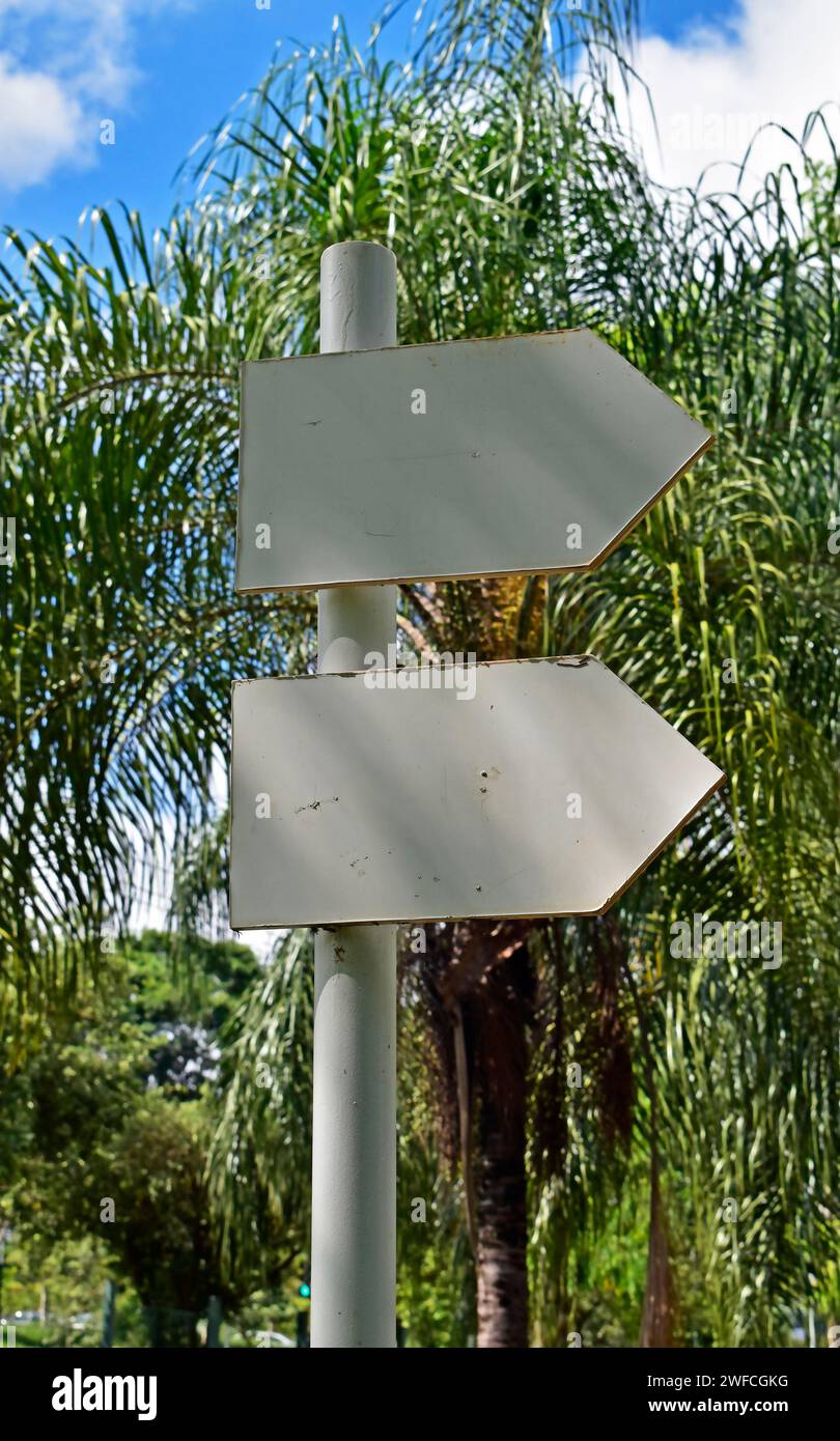 Two white signs on public park Stock Photo - Alamy