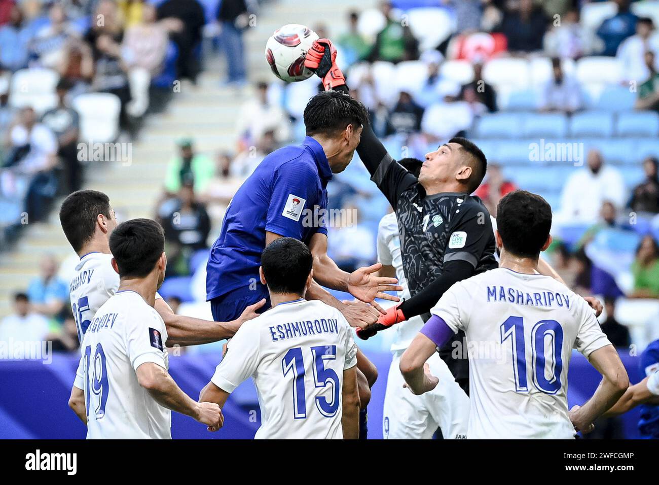 Doha, Qatar. 30th Jan, 2024. Uzbekistan's goalkeeper Utkir Yusupov (2nd ...