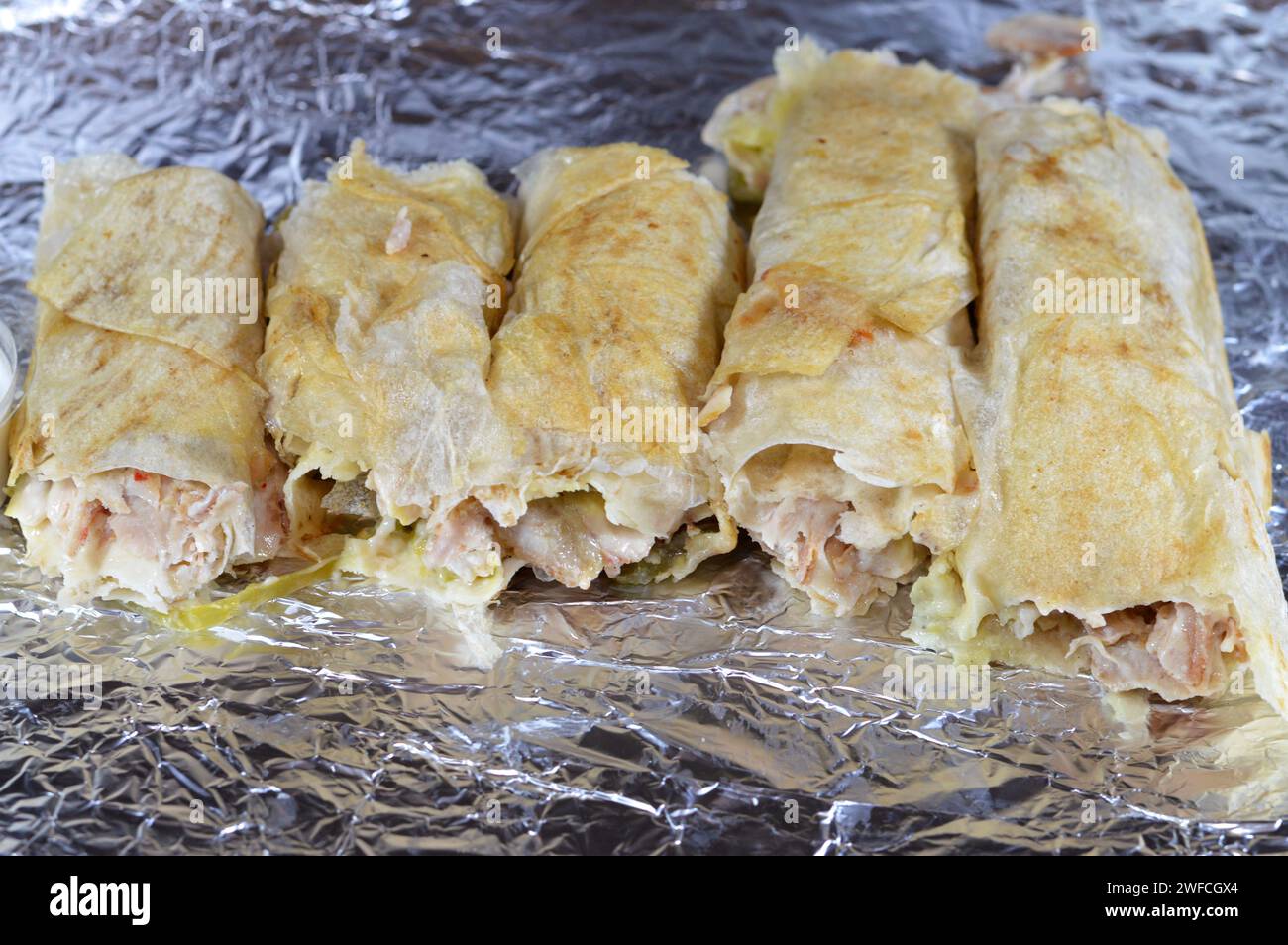 Syrian recipe cuisine background, chicken shawerma or shawarma tortilla ...