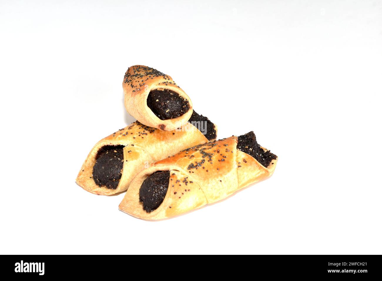 On a white background, three buns baked from puff pastry and filled ...