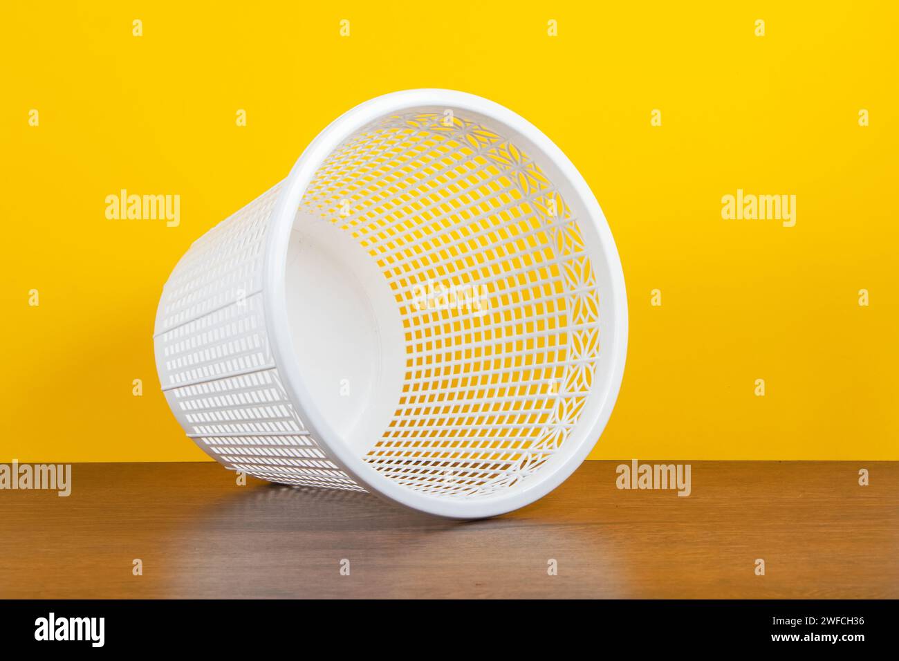 Empty overturned can trash, clean garbage bin, plastic basket bin on ...