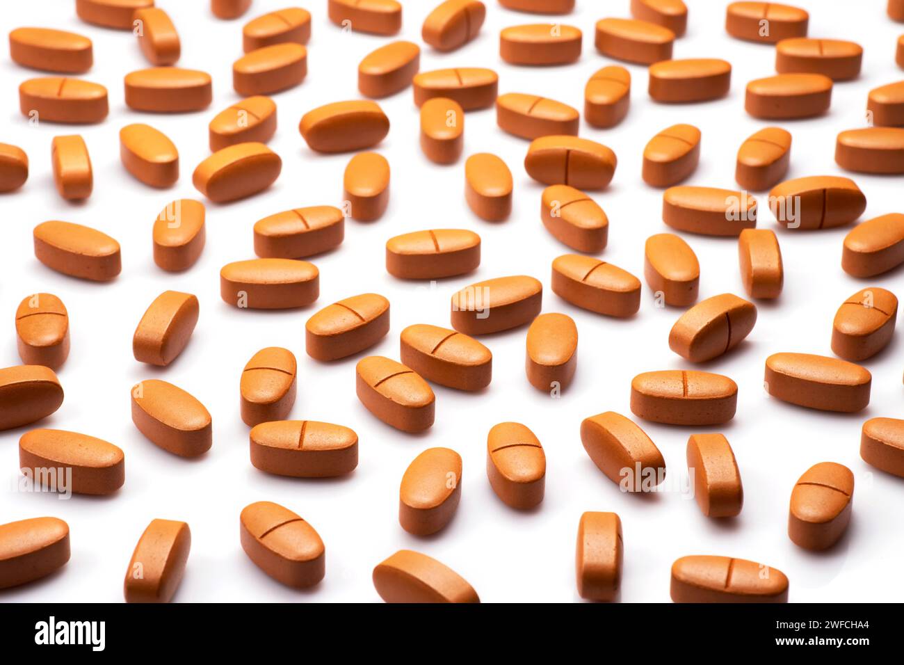 Brown pill on a white background. Vitamins on a white background Stock ...