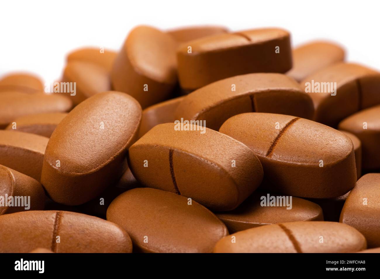 Pile of brown tablets pills. Prescription drugs. Pharmaceutical ...