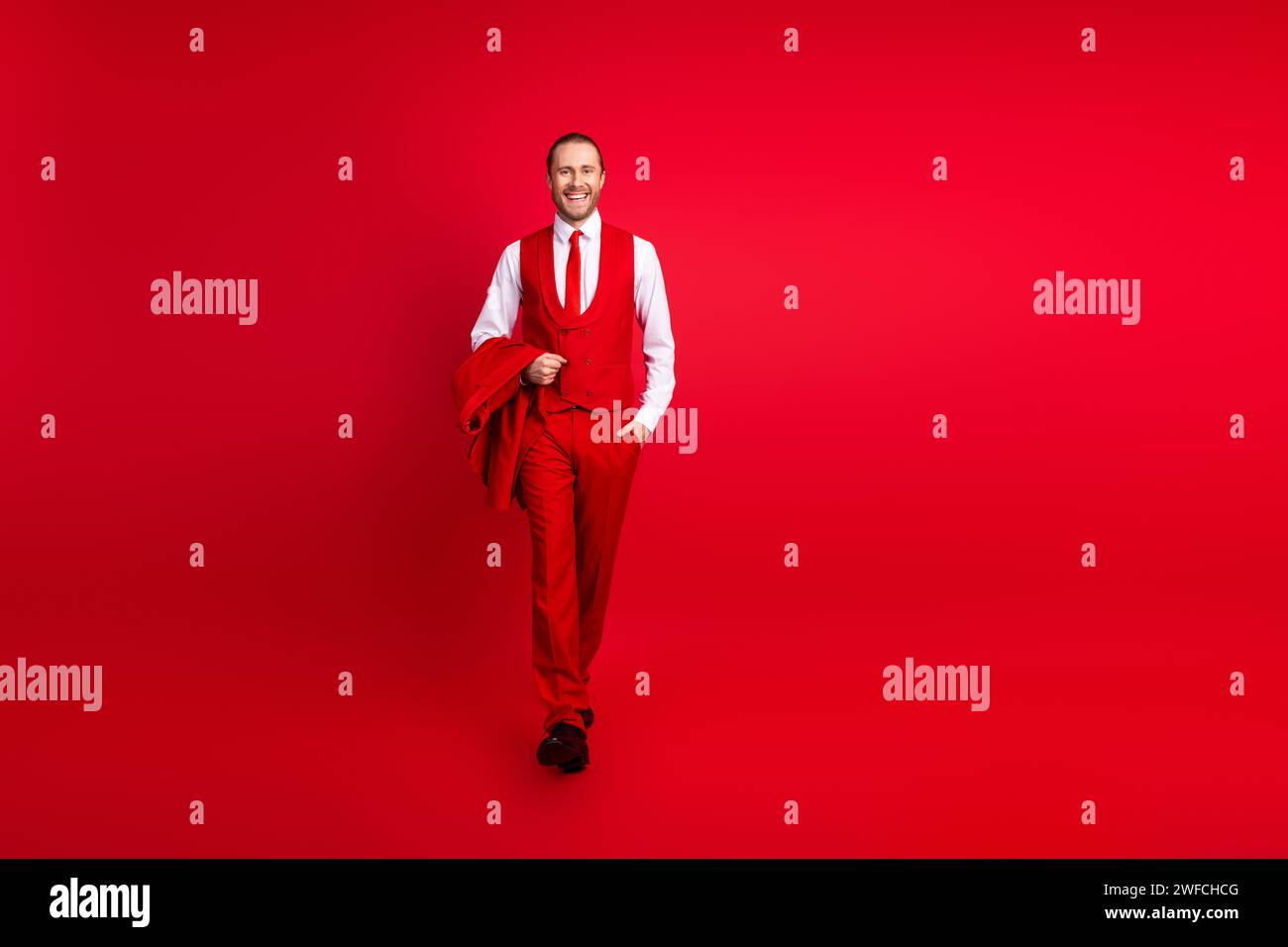 Full body photo of attractive young man confident walking hold jacket ...