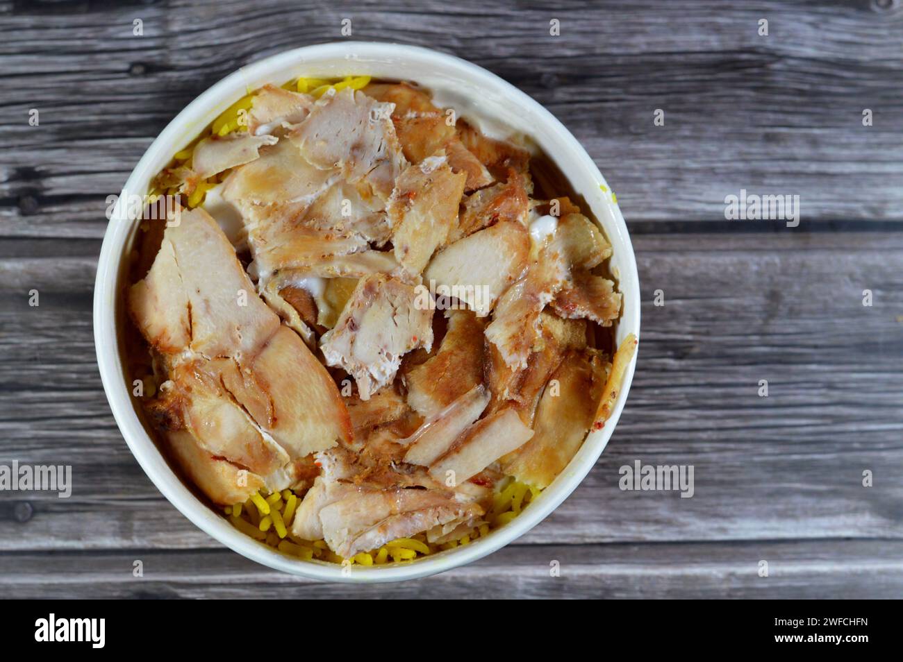 Pieces of Chicken shawarma with yellow Basmati rice, Syrian bread and ...