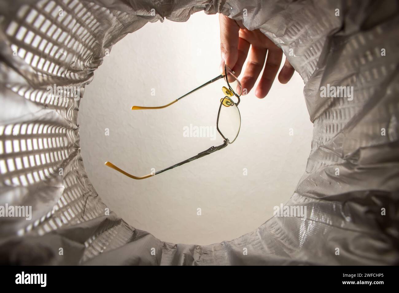 throwing glass in the trash inside view. Vision correction Stock Photo ...