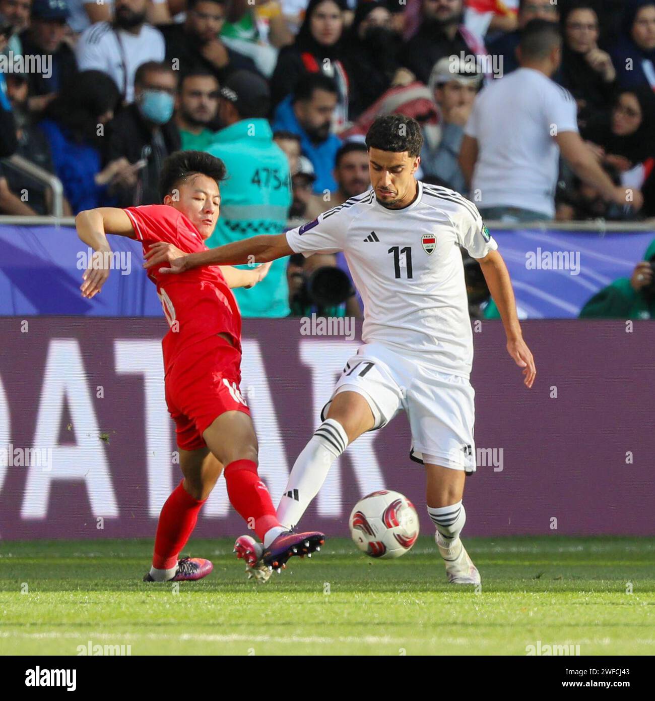 Doha, Qatar. 24th Jan, 2024. Zidane Iqbal of Iraq and Thai Son Nguyen ...