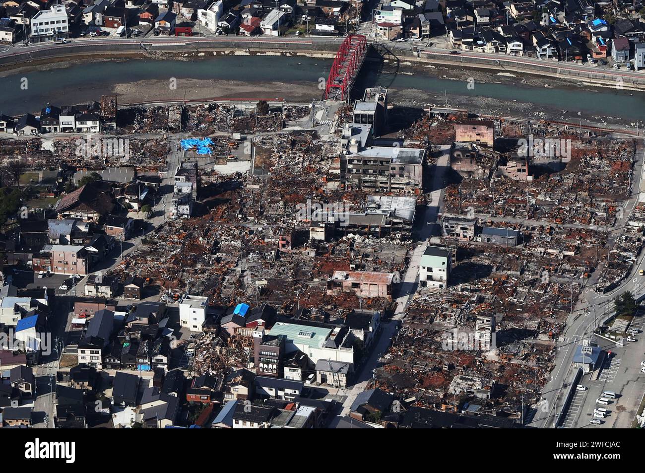 An aerial photo shows a disaster-stricken area damaged by a massive ...