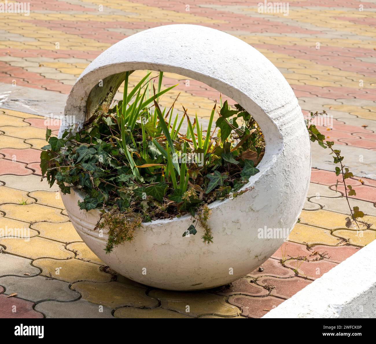 Design of a flower bed in the form of a concrete sphere with a cutout ...