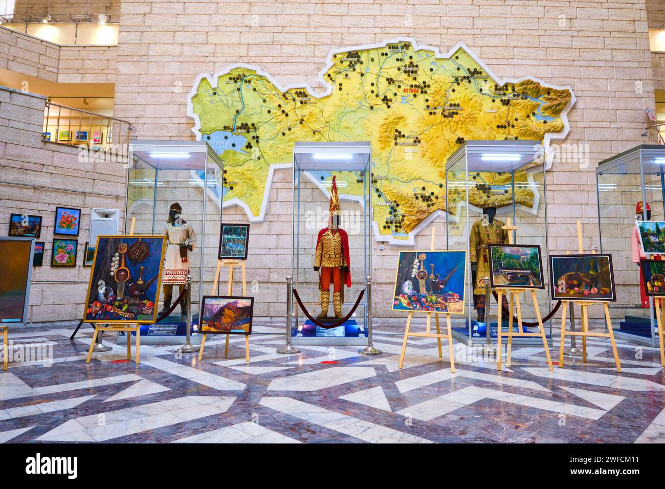 Interior view of the main entrance airy atrium with a large map and ...