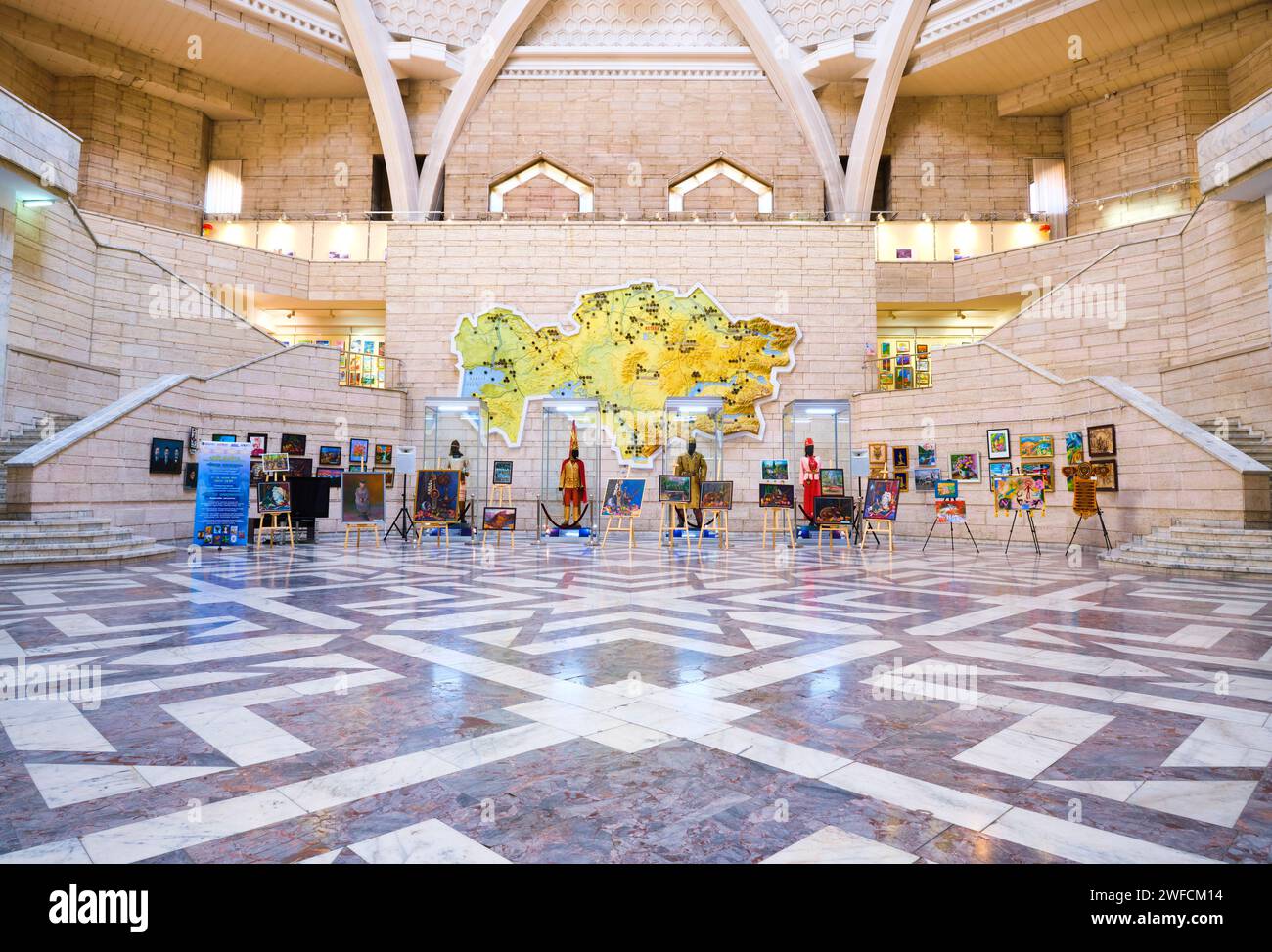 Interior view of the main entrance airy atrium with a large map and ...