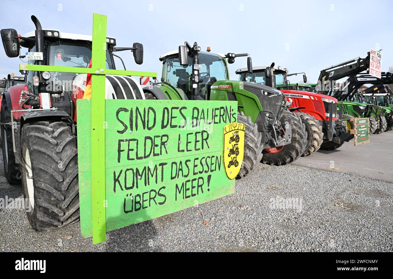 Stuttgart, Germany. 30th Jan, 2024. Farmers with tractors and a banner ...