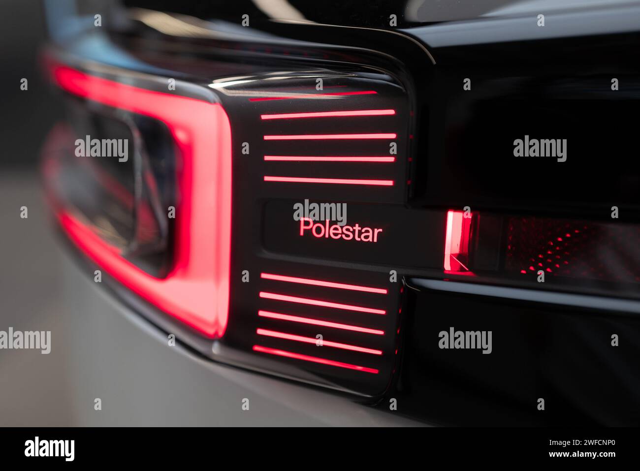 Close-up of illuminated Polestar vehicle emblem and taillight design at ...