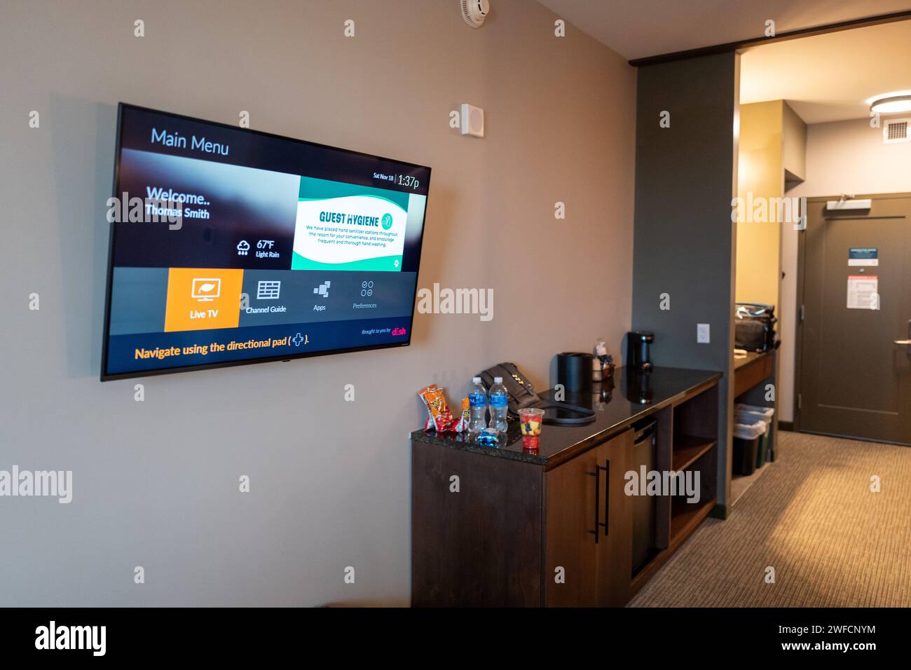 Welcome screen of a guest room smart TV displaying weather and hotel ...