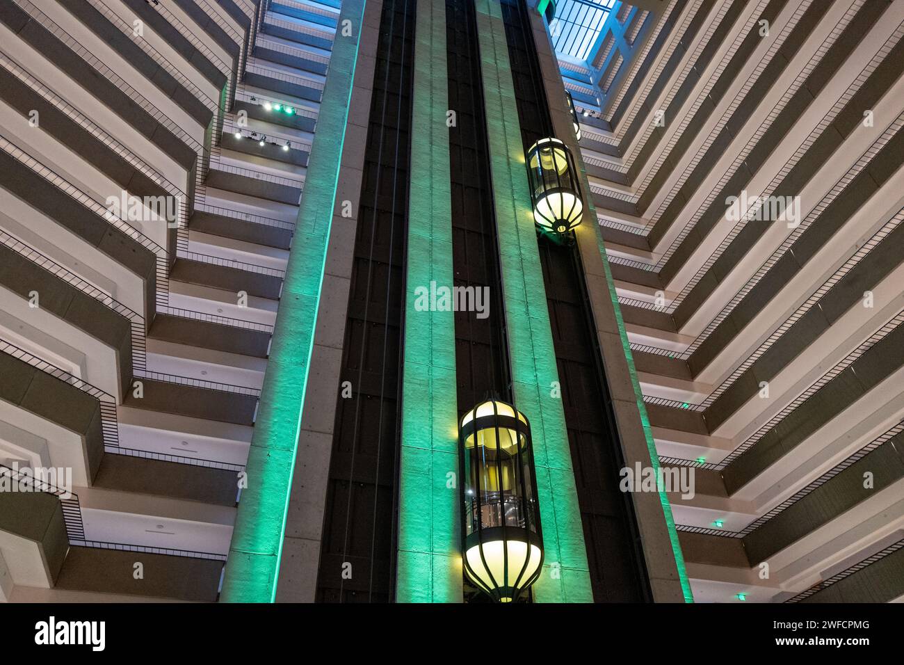 Illuminated glass elevators at the Hyatt Regency Embarcadero hotel in ...