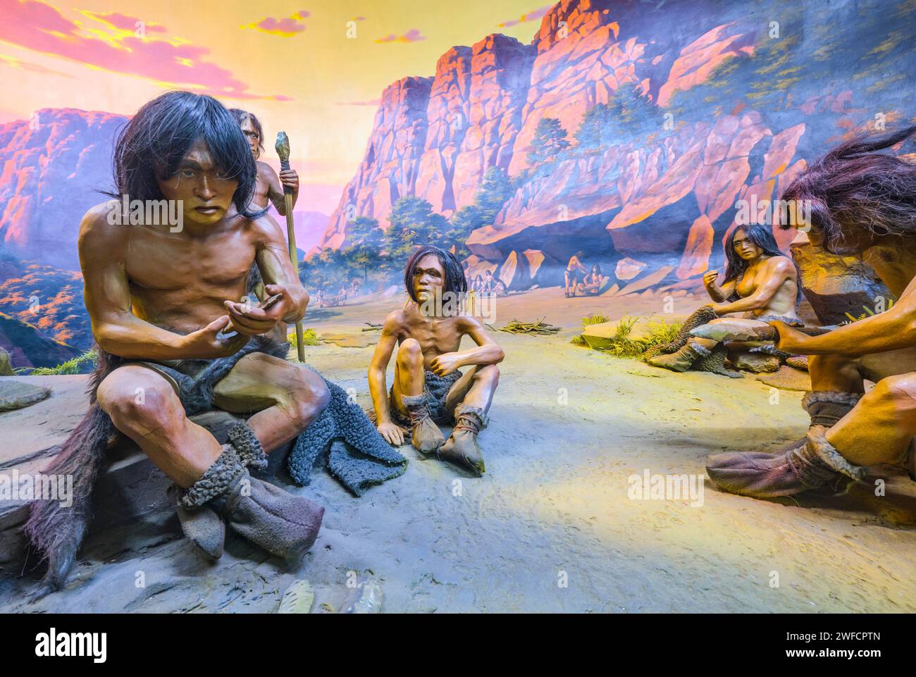 View of a diorama featuring a typical stone age, cave man, paleolithic ...