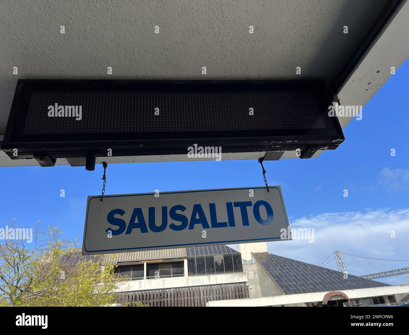 Hanging 'SAUSALITO' sign with a view of the Bay Bridge in the ...