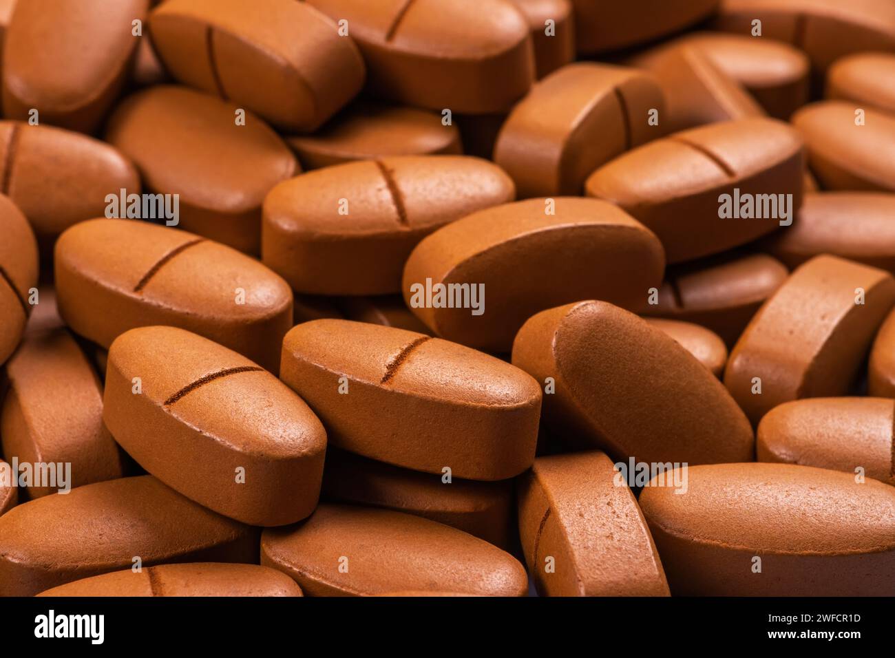 Pile of brown tablets pills. Prescription drugs. Pharmaceutical ...