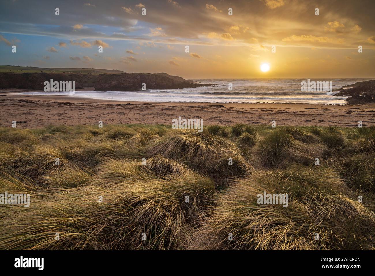 Porth Trecastell (Cable Bay) on the Isle of Anglesey coast at sunset ...