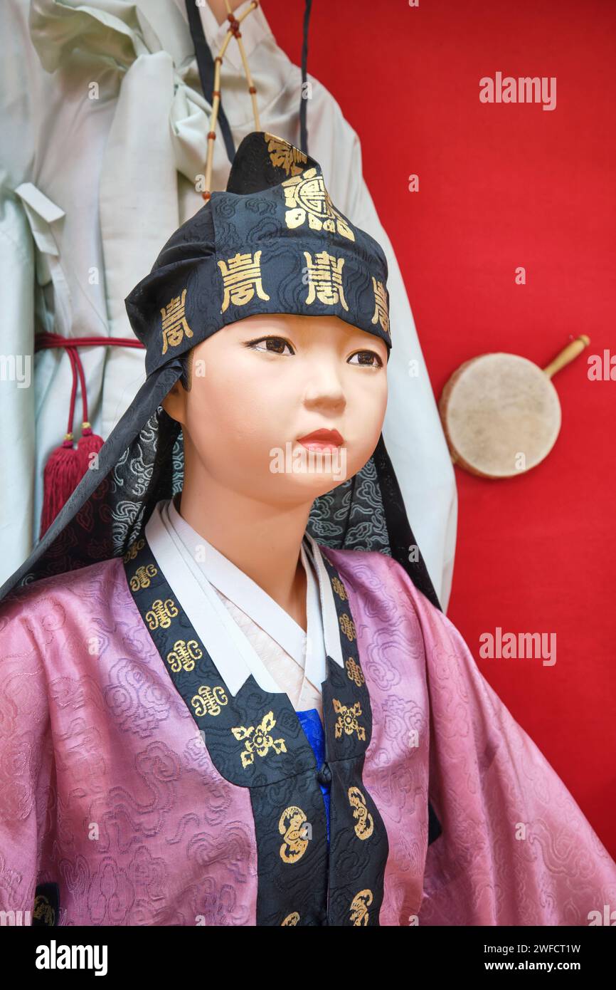 A display of old, traditional, ceremonial clothing worn by someone of ...